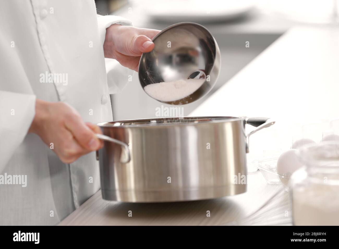 Female chef working at kitchen Stock Photo - Alamy