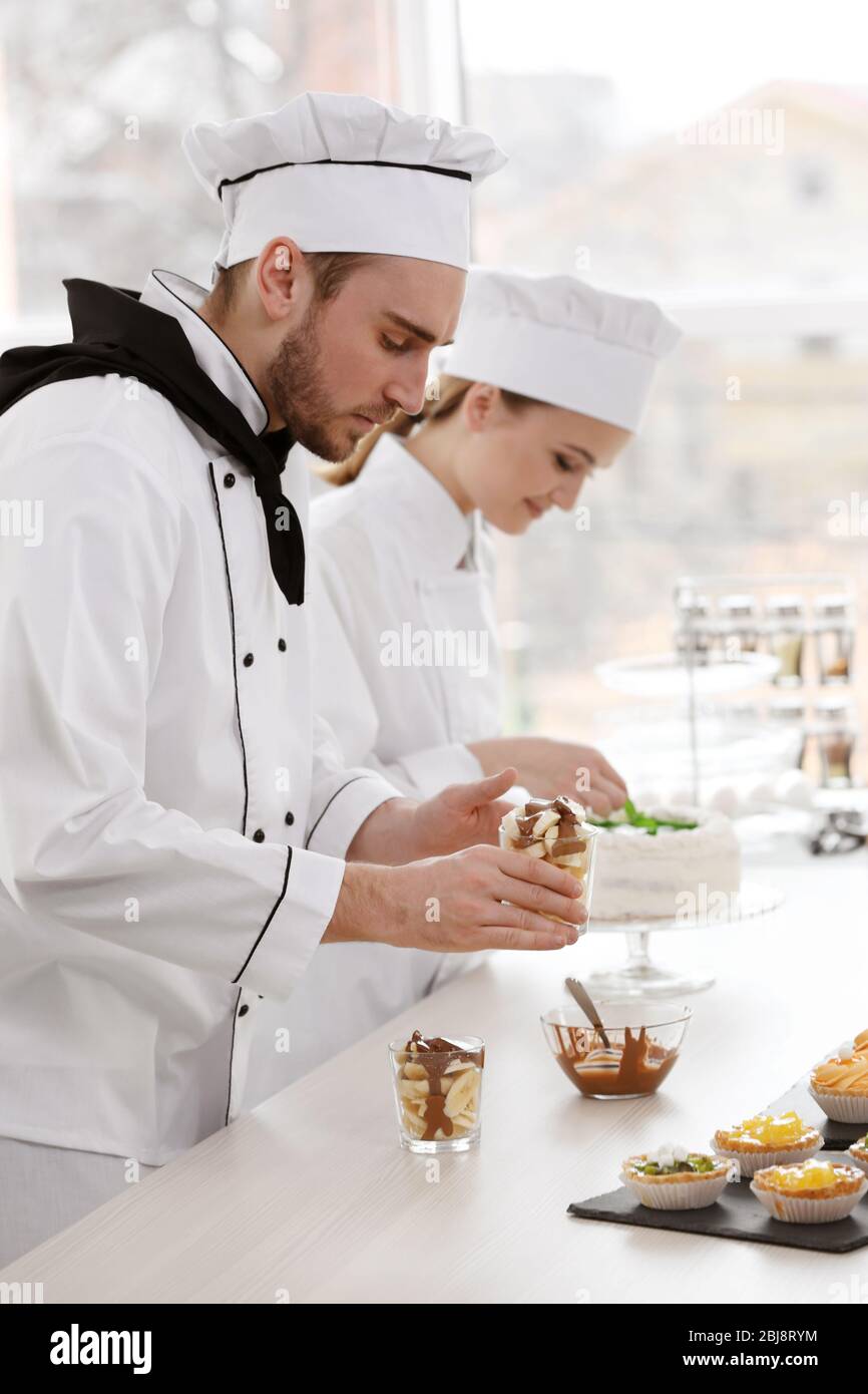 Male chef checking his work Stock Photo - Alamy