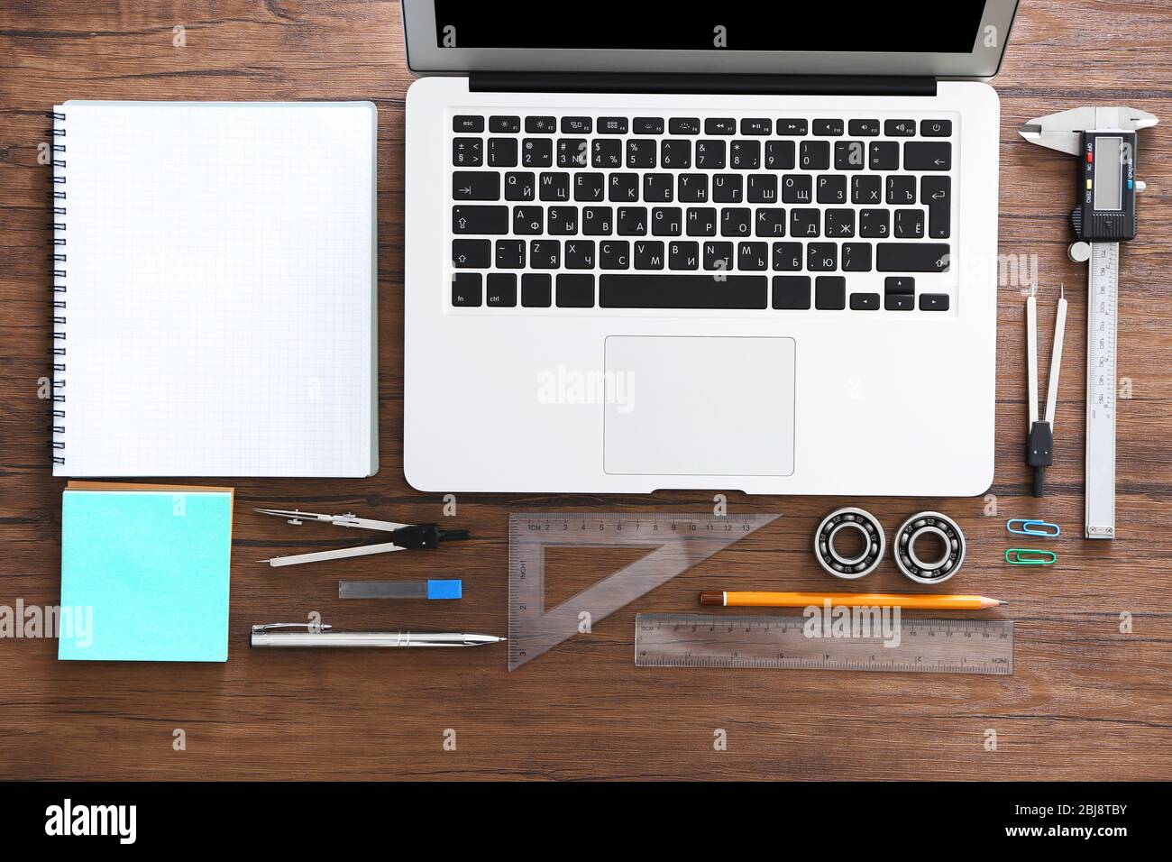 Laptop and engineering tools on wooden table, top view Stock Photo - Alamy
