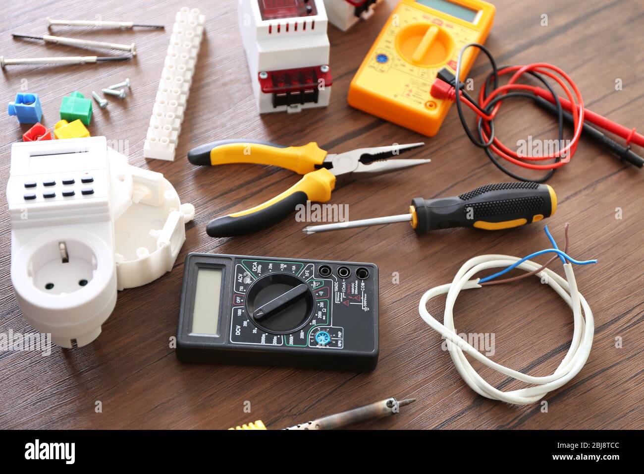 Different electrical tools on wooden table, top view Stock Photo - Alamy