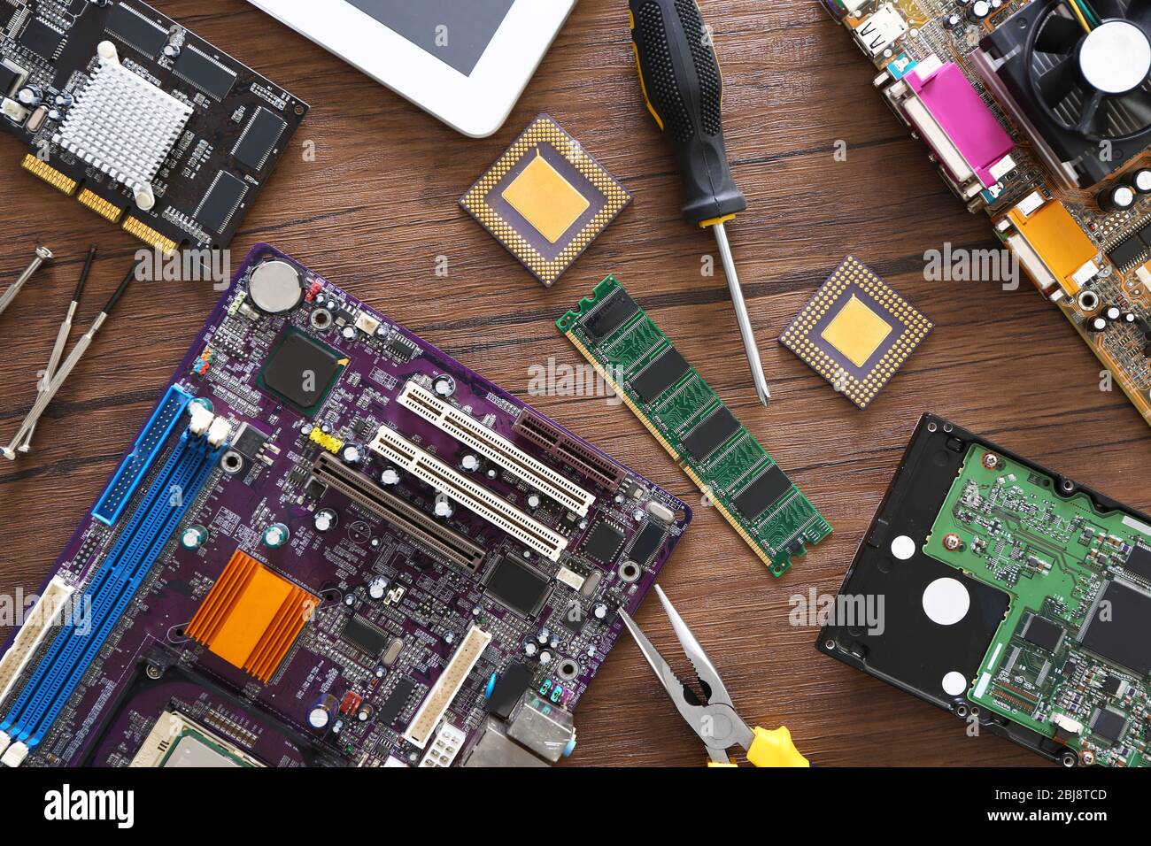 Electronic circuits on wooden table, top view Stock Photo - Alamy