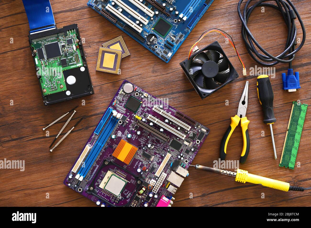 Electronic circuits on wooden table, top view Stock Photo - Alamy