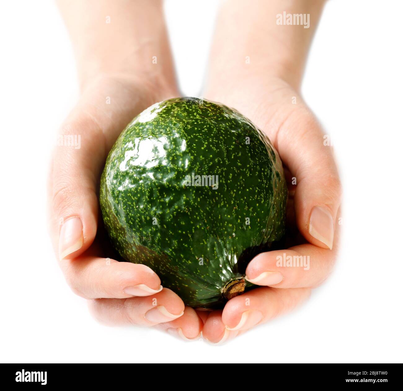 Female hands holding fresh avocado isolated on white Stock Photo - Alamy
