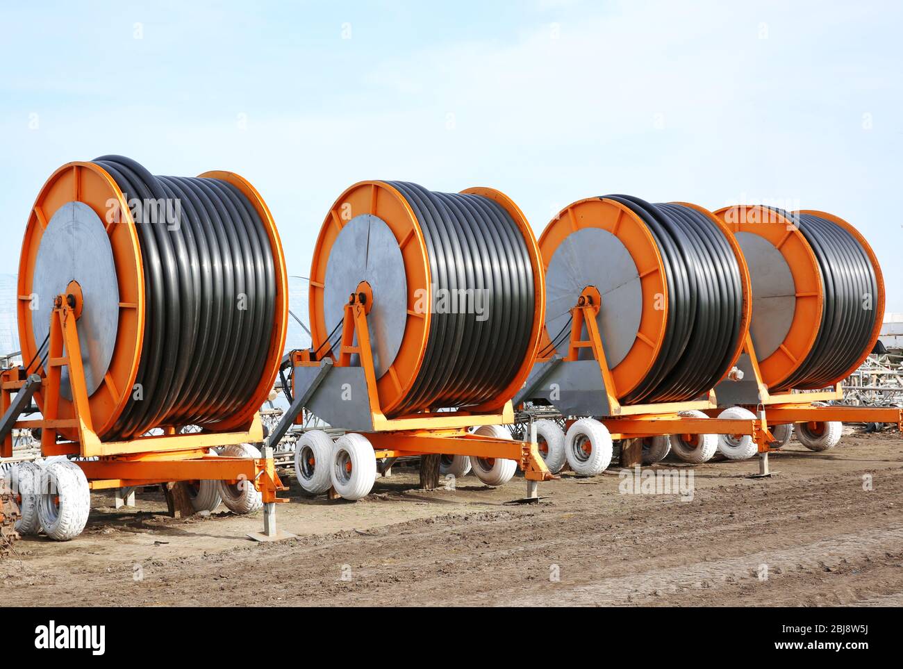 Hose reel of irrigate machine outdoor Stock Photo - Alamy