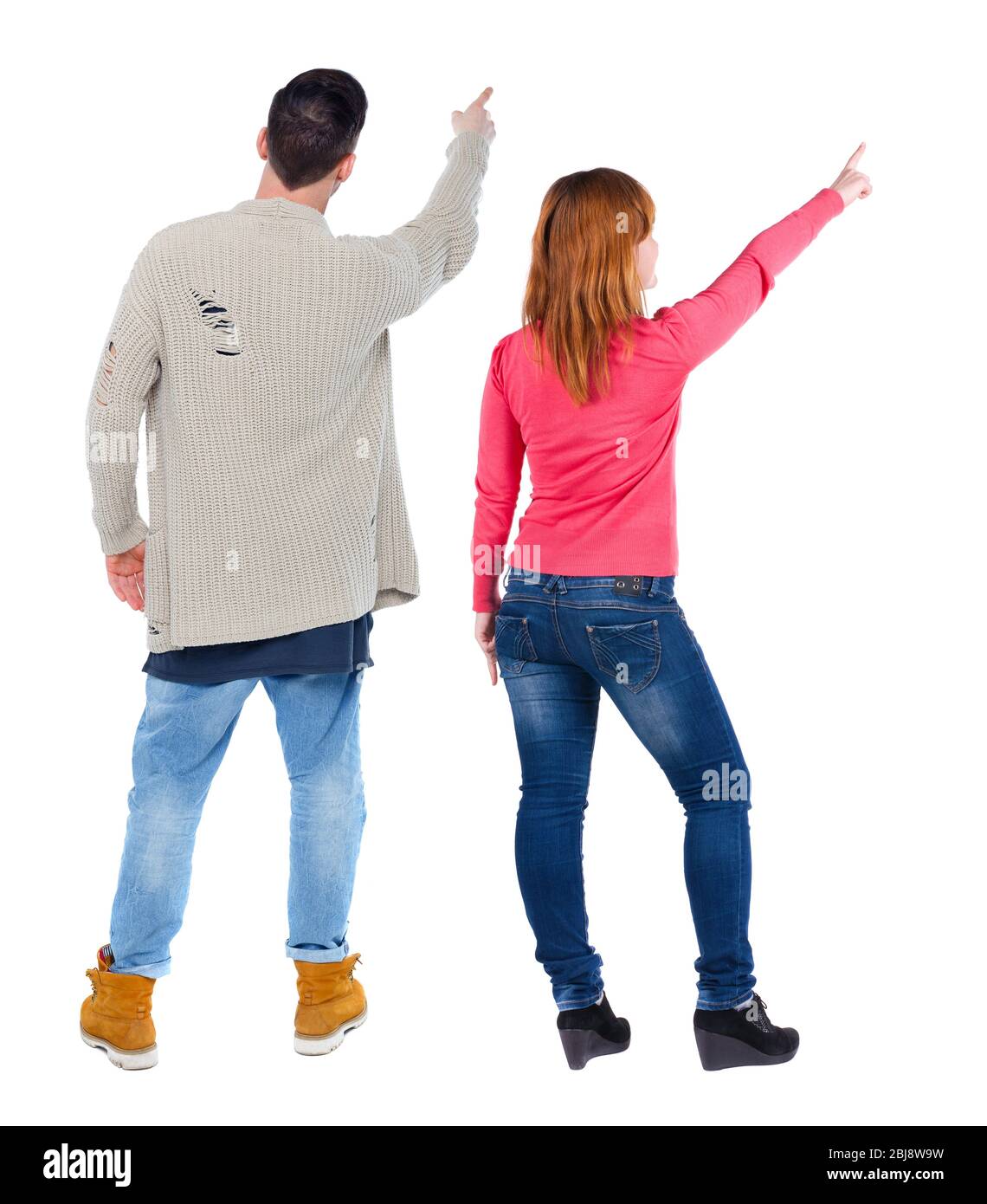Back view of couple in sweater pointing. Rear view people collection ...