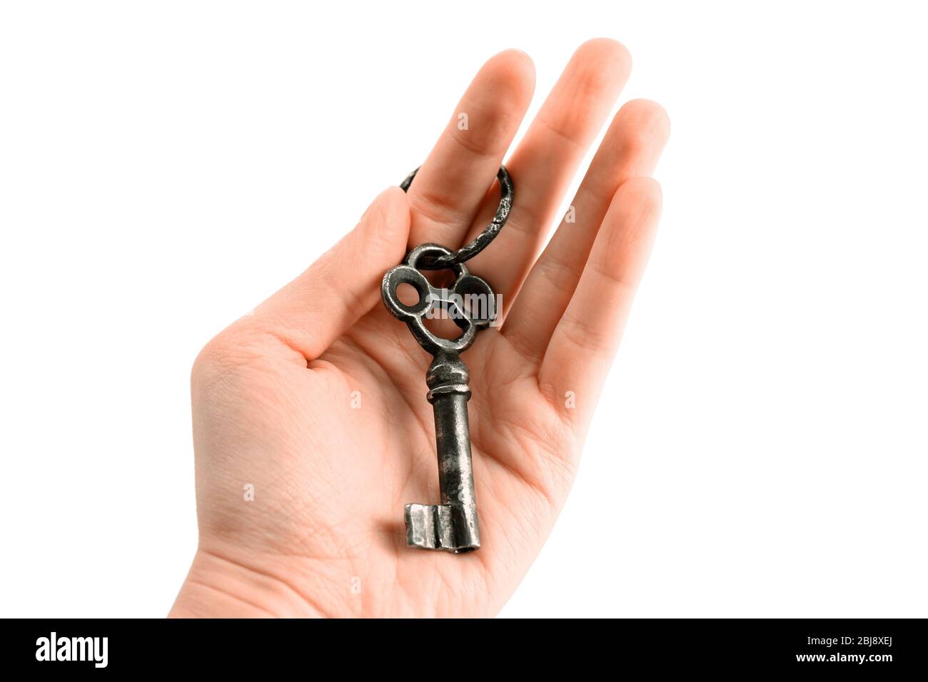 Hand holding an old key isolated on white Stock Photo - Alamy