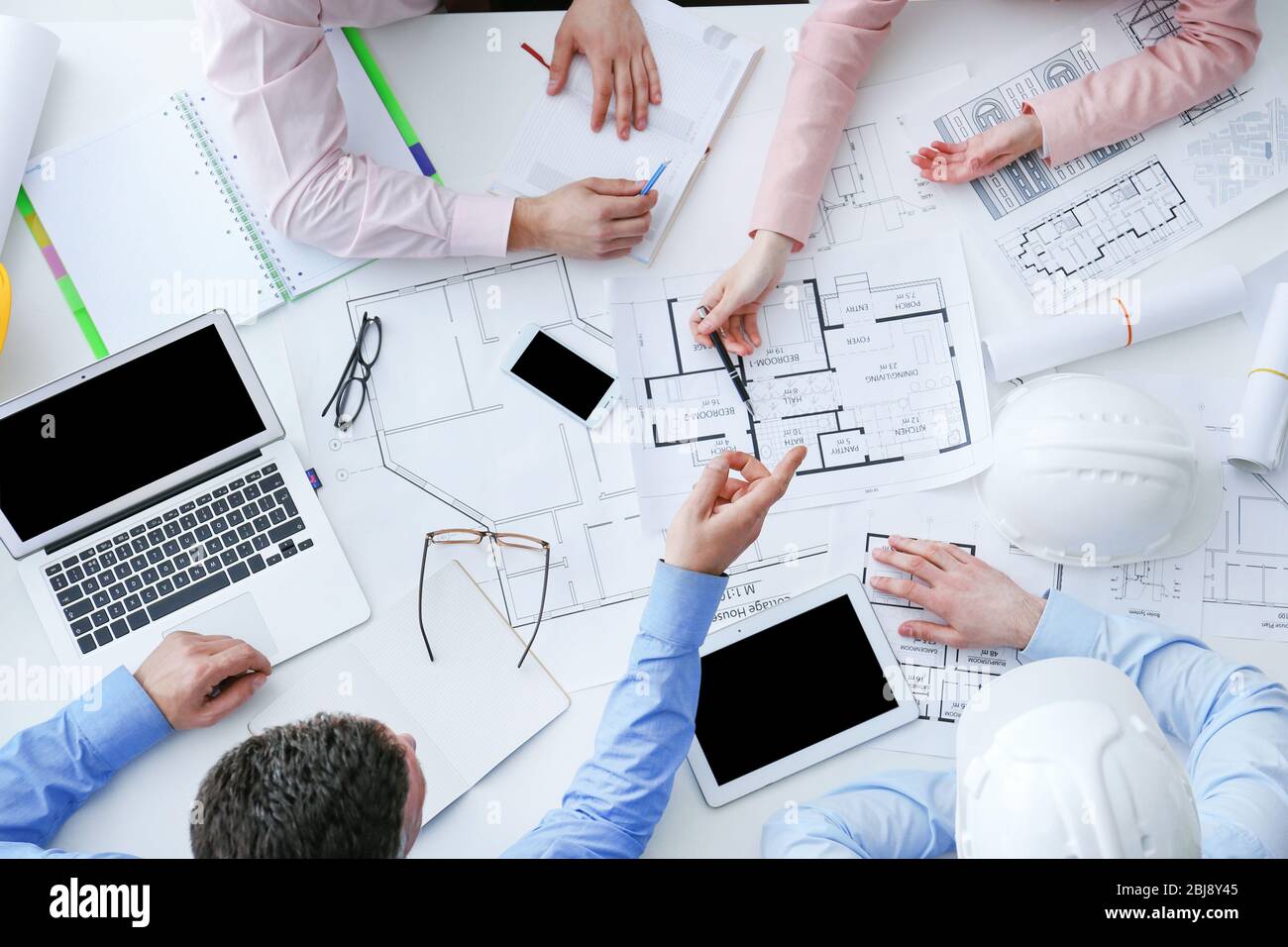 Young engineers working in the office, top view Stock Photo - Alamy