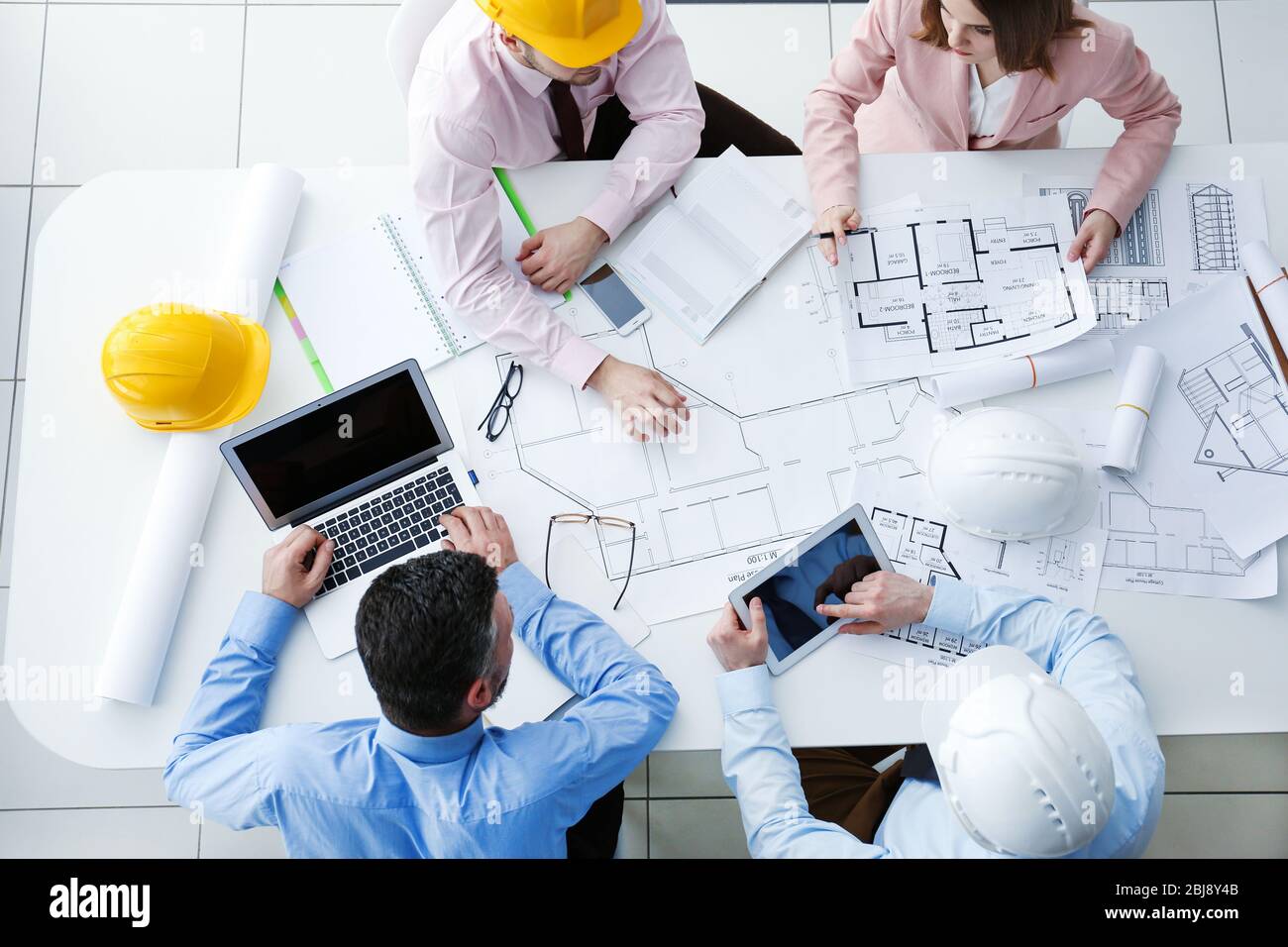 Young engineers working in the office, top view Stock Photo - Alamy