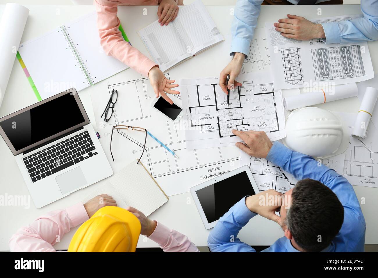 Young engineers working in the office, top view Stock Photo - Alamy