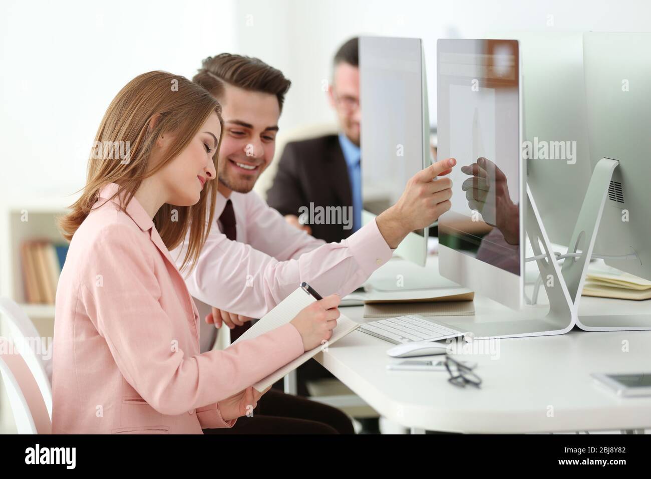 Young engineers working in the office Stock Photo - Alamy