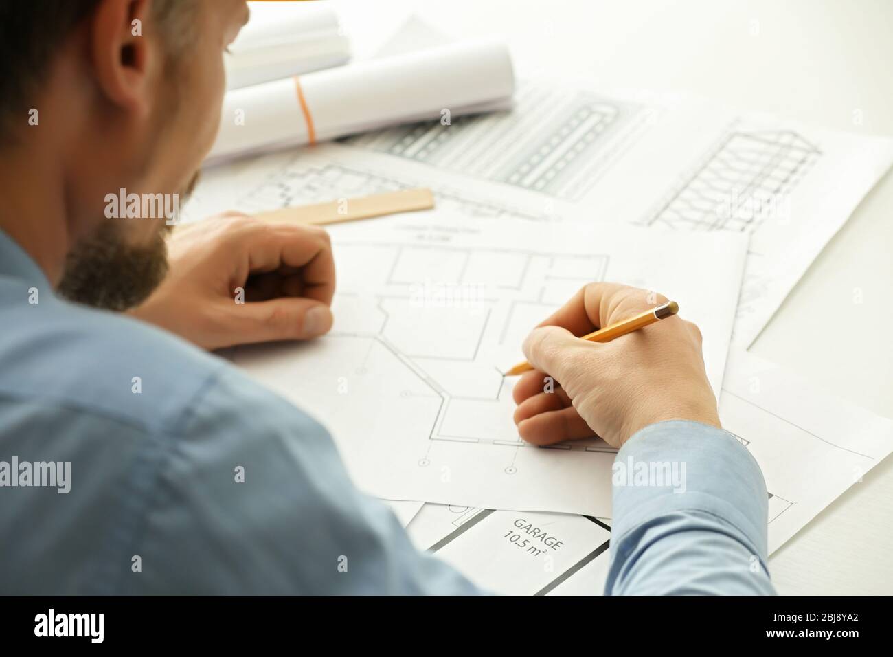 Male construction engineer working in the office Stock Photo - Alamy