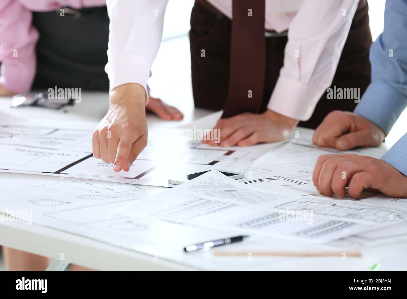 Young engineers working plan construction hi-res stock photography and ...