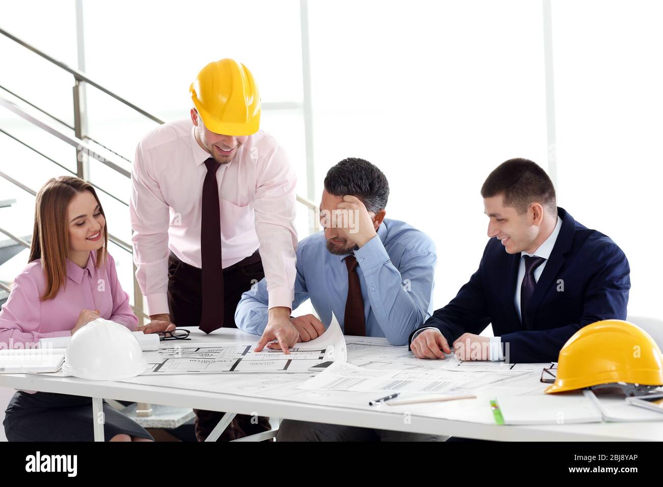Young engineers working in the office Stock Photo - Alamy