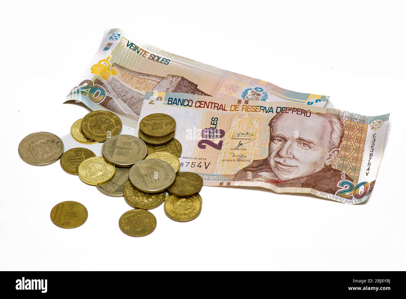 Peruvian soles of paper and coin on a white background Stock Photo - Alamy