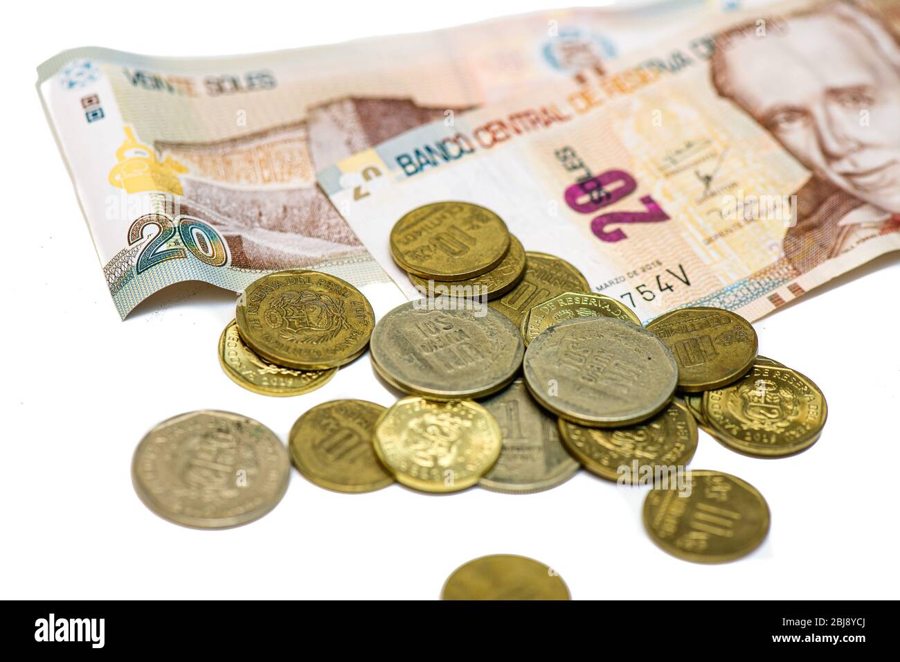 Peruvian soles of paper and coin on a white background Stock Photo - Alamy