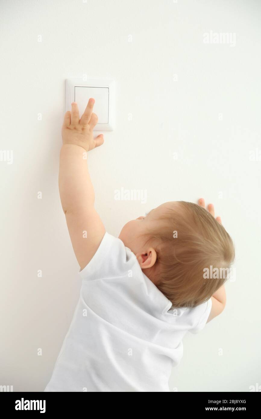 Little child playing with switch Stock Photo - Alamy