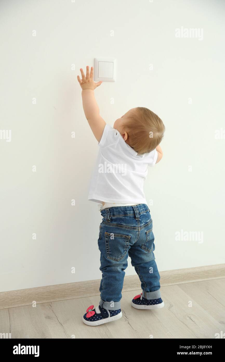 Little child playing with switch Stock Photo - Alamy