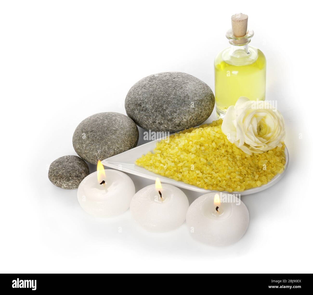 Spa still life with pebbles, oil and candles isolated on white Stock ...