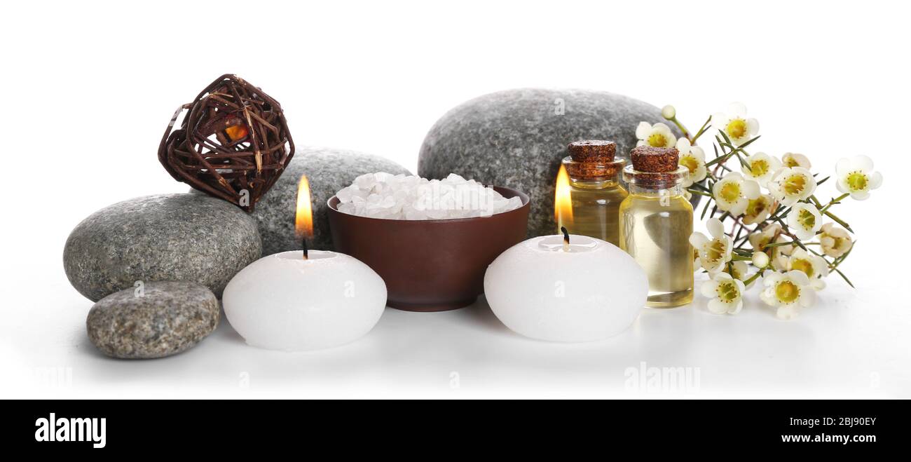 Spa still life with pebbles and candles isolated on white Stock Photo ...
