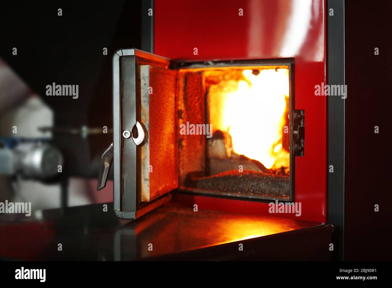 Solid-fuel boiler in the boiler room Stock Photo - Alamy