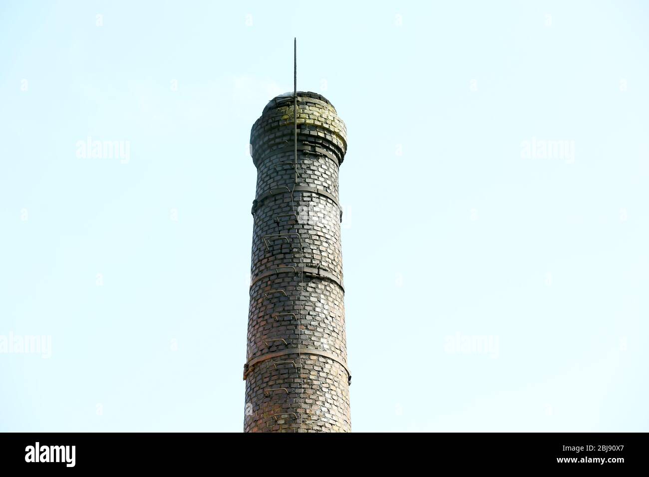 Brick industrial flue on sky background Stock Photo - Alamy