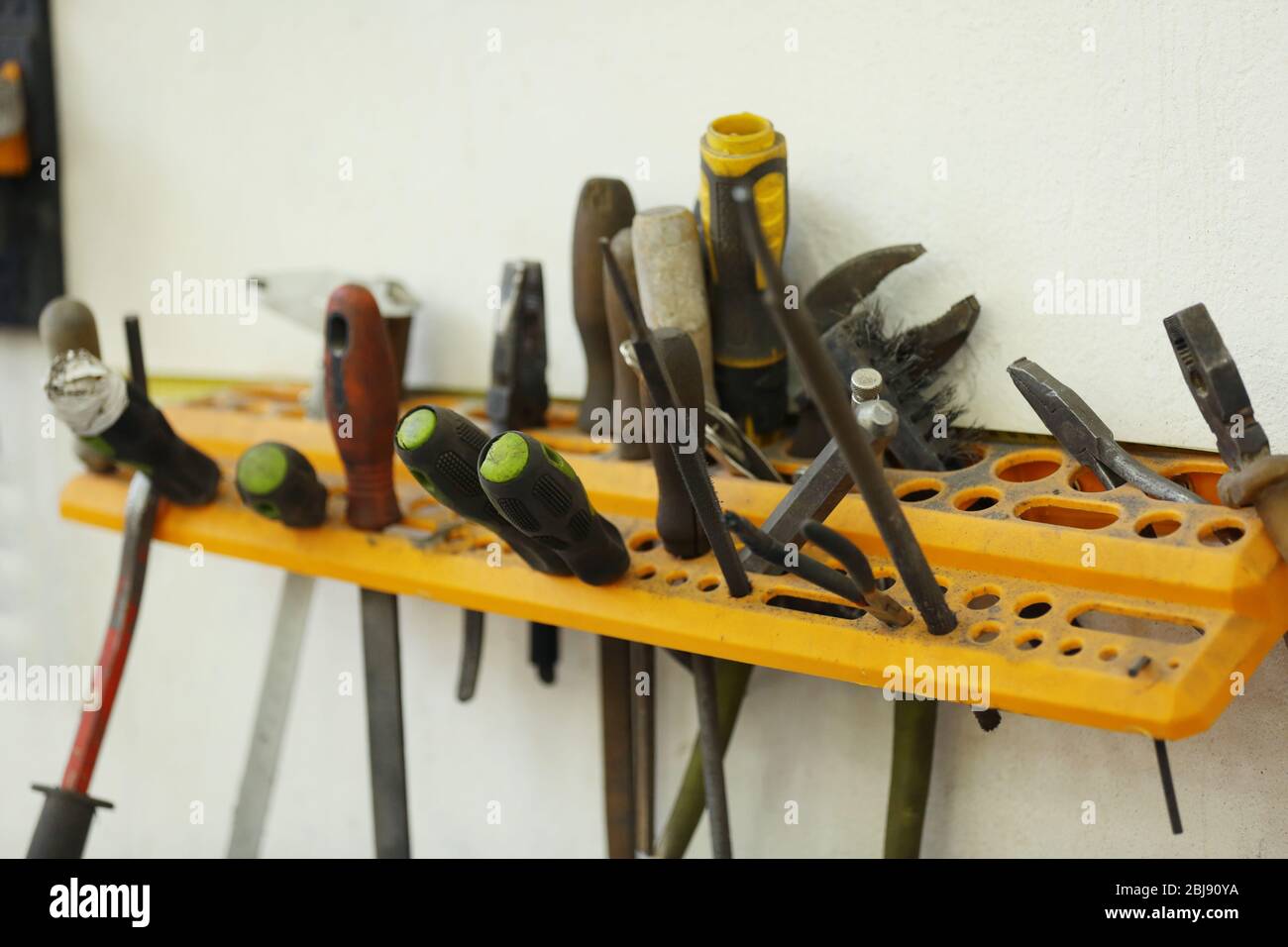 Set of working instrument in garage Stock Photo - Alamy