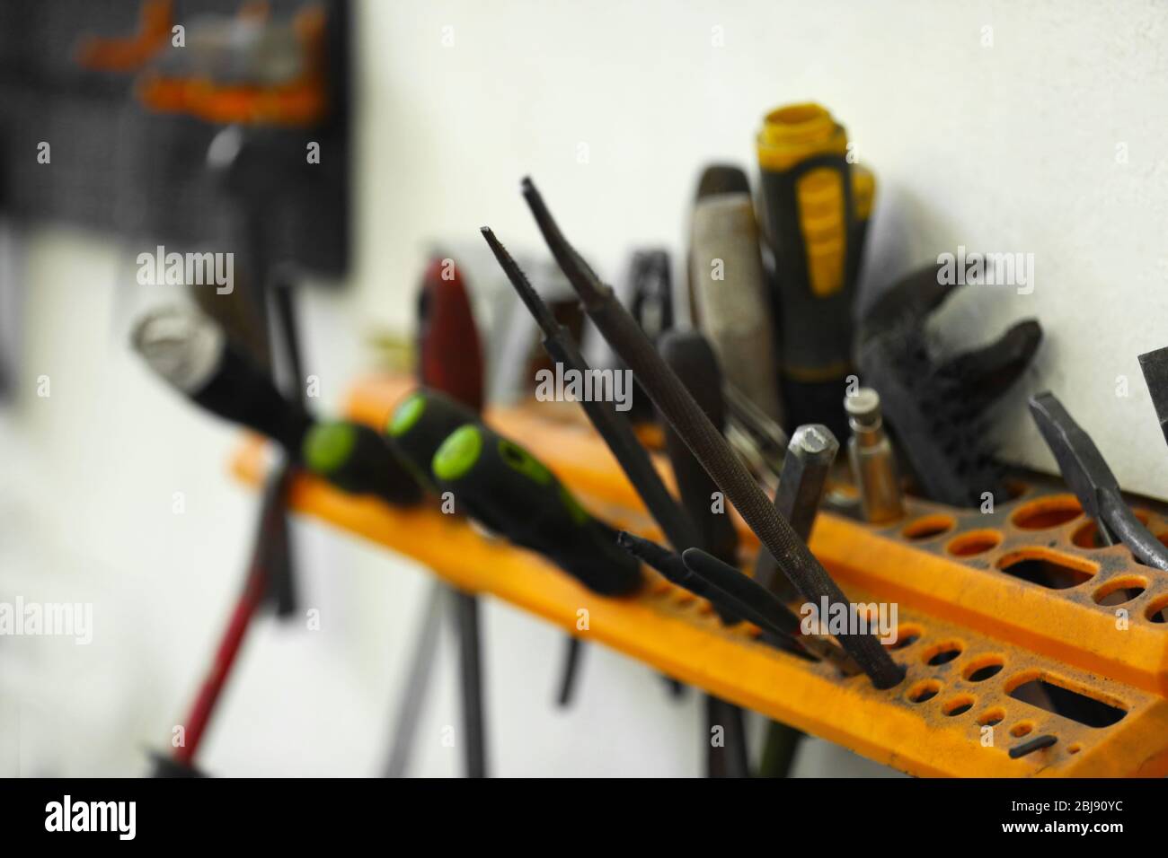 Set of working instrument in garage Stock Photo - Alamy