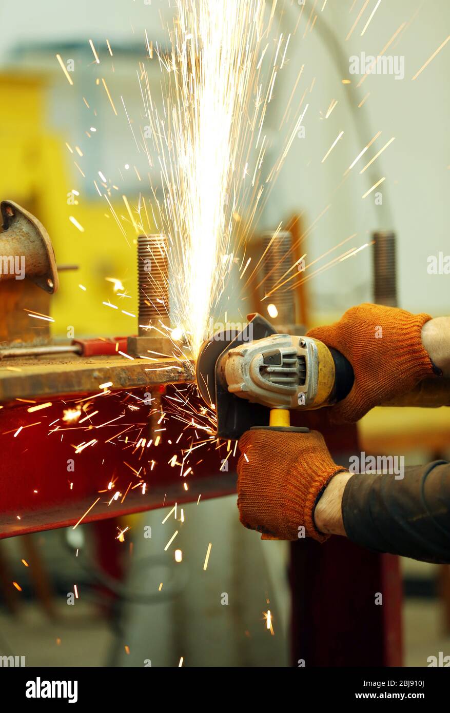 Man working with angle grinder Stock Photo - Alamy