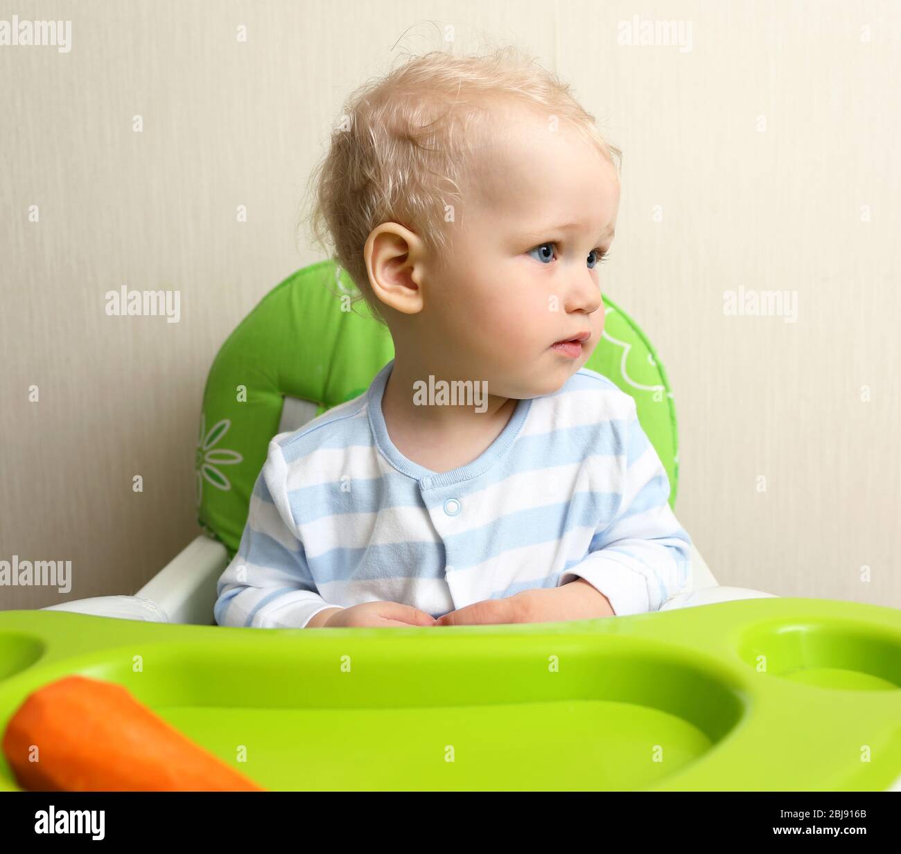 Cute baby at the table Stock Photo - Alamy