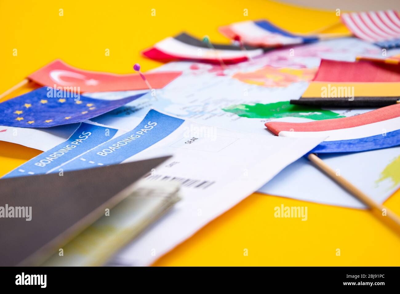 Flags from different countries and boarding pass over world map Stock ...