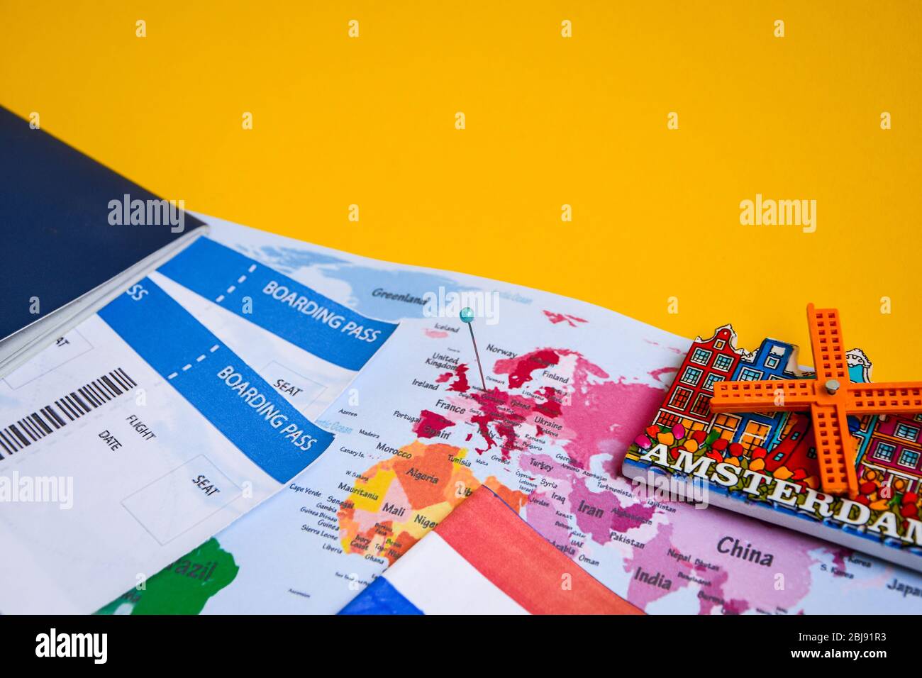 Netherlands travel concept, passport with boarding pass, magnet from ...