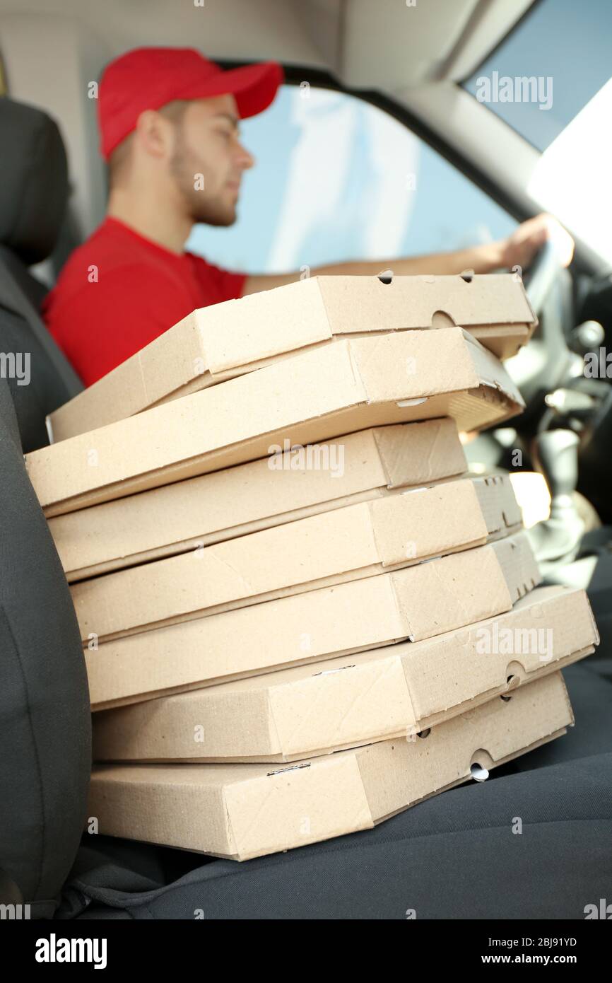 Man holding many pizza hi-res stock photography and images - Alamy
