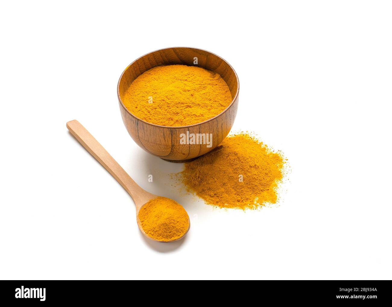 Dried turmeric powder in wooden bowl and wooden spoon curcumin , yellow ...