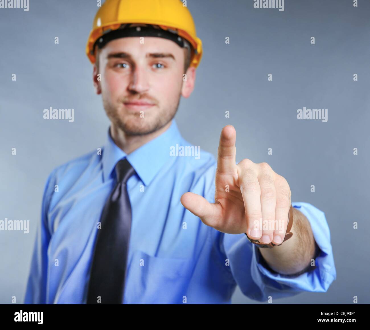 Hand pointing on construction plan hi-res stock photography and images ...
