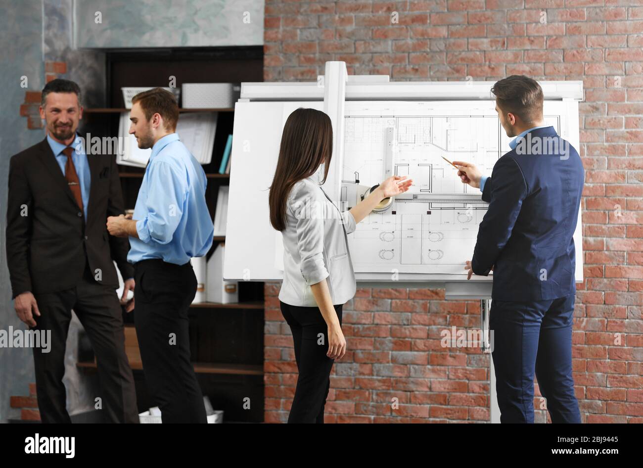Engineers working with panel board indoors Stock Photo - Alamy