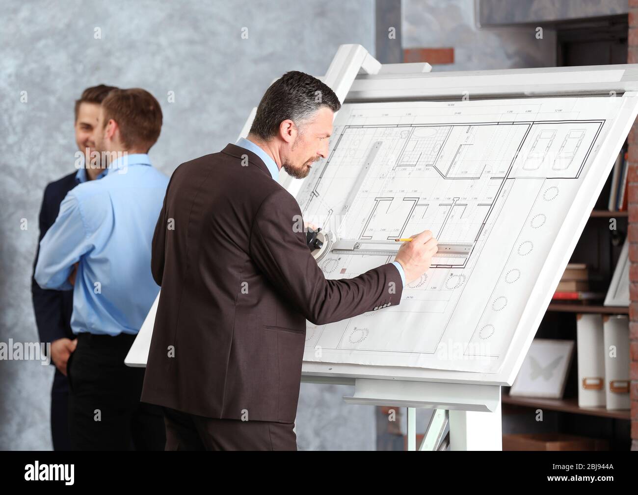 Engineers working at drawing board hi-res stock photography and images ...