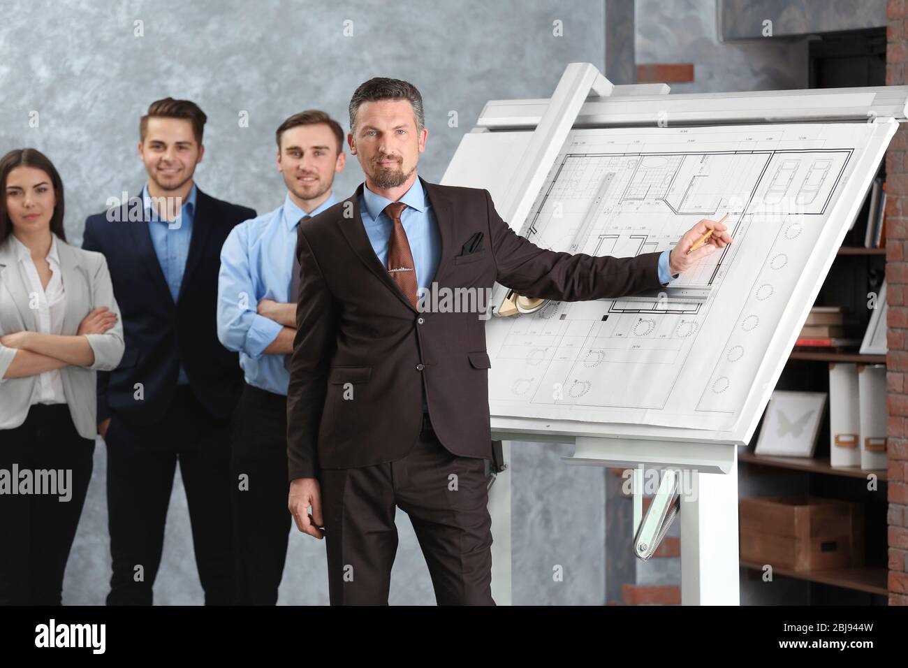 Engineers working with panel board indoors Stock Photo - Alamy