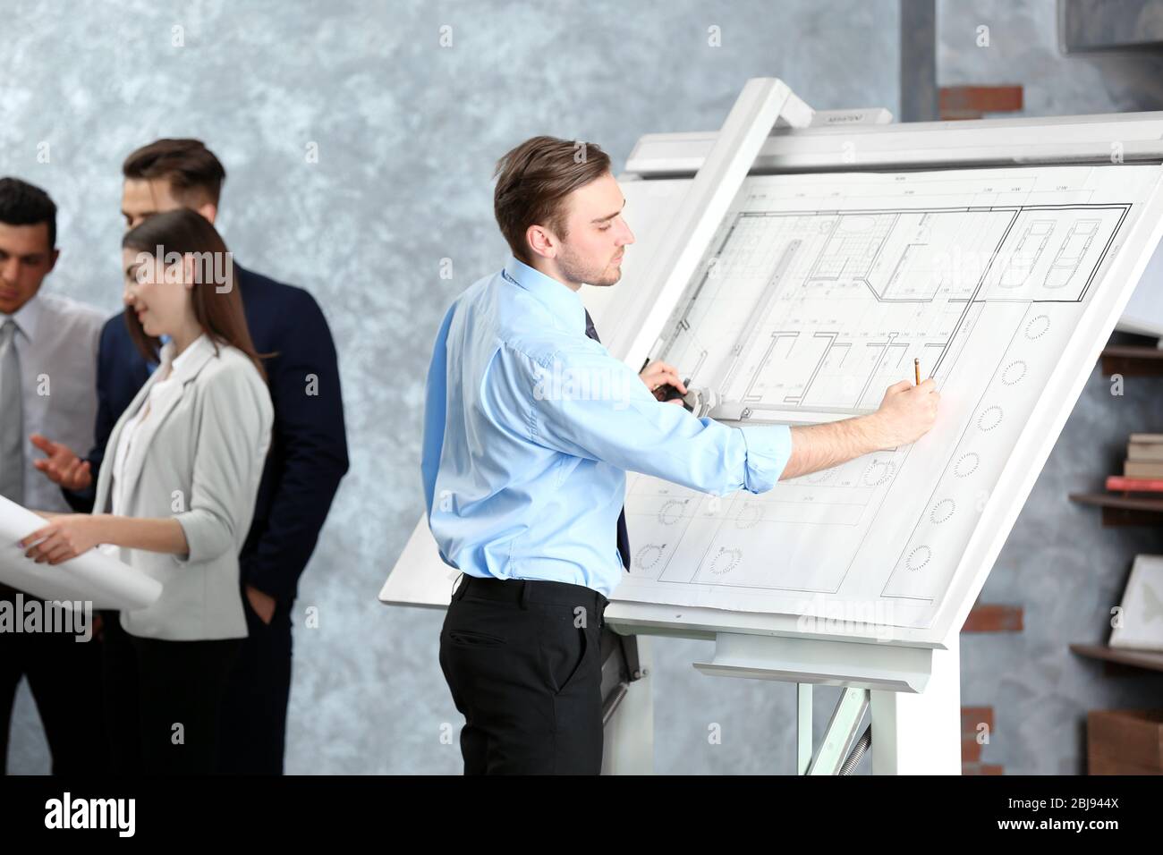 Engineers working with panel board indoors Stock Photo - Alamy
