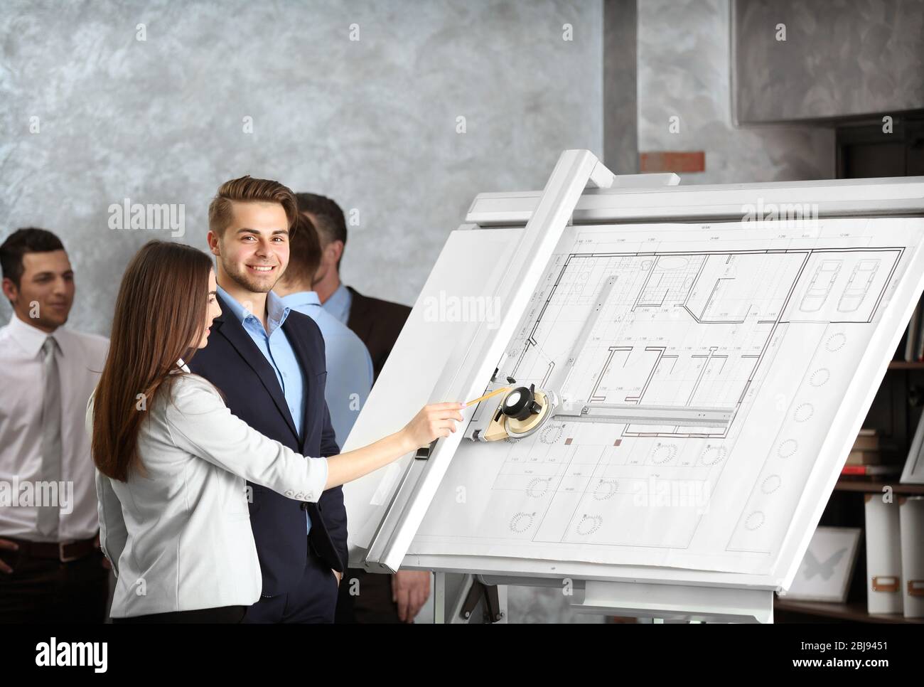 Engineers working with panel board indoors Stock Photo - Alamy