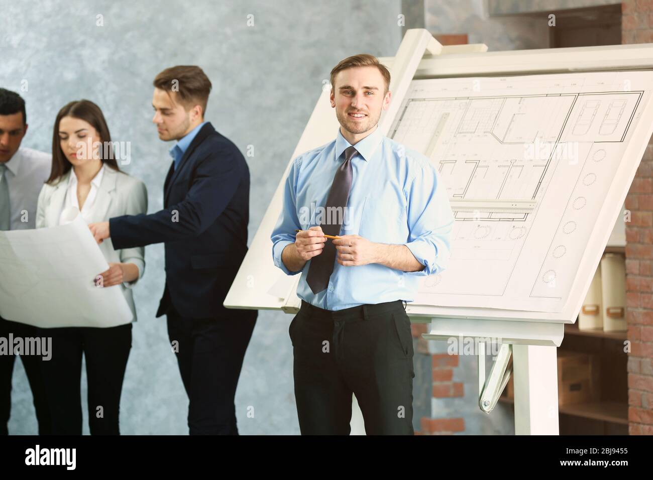 Engineers working with panel board indoors Stock Photo - Alamy