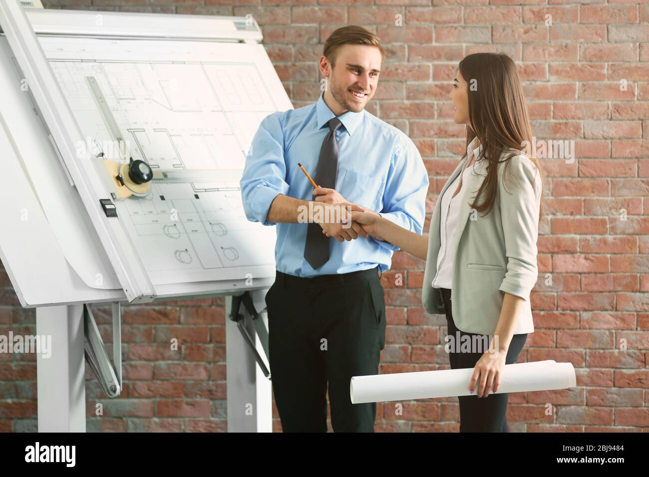 Engineers working with panel board indoors Stock Photo - Alamy