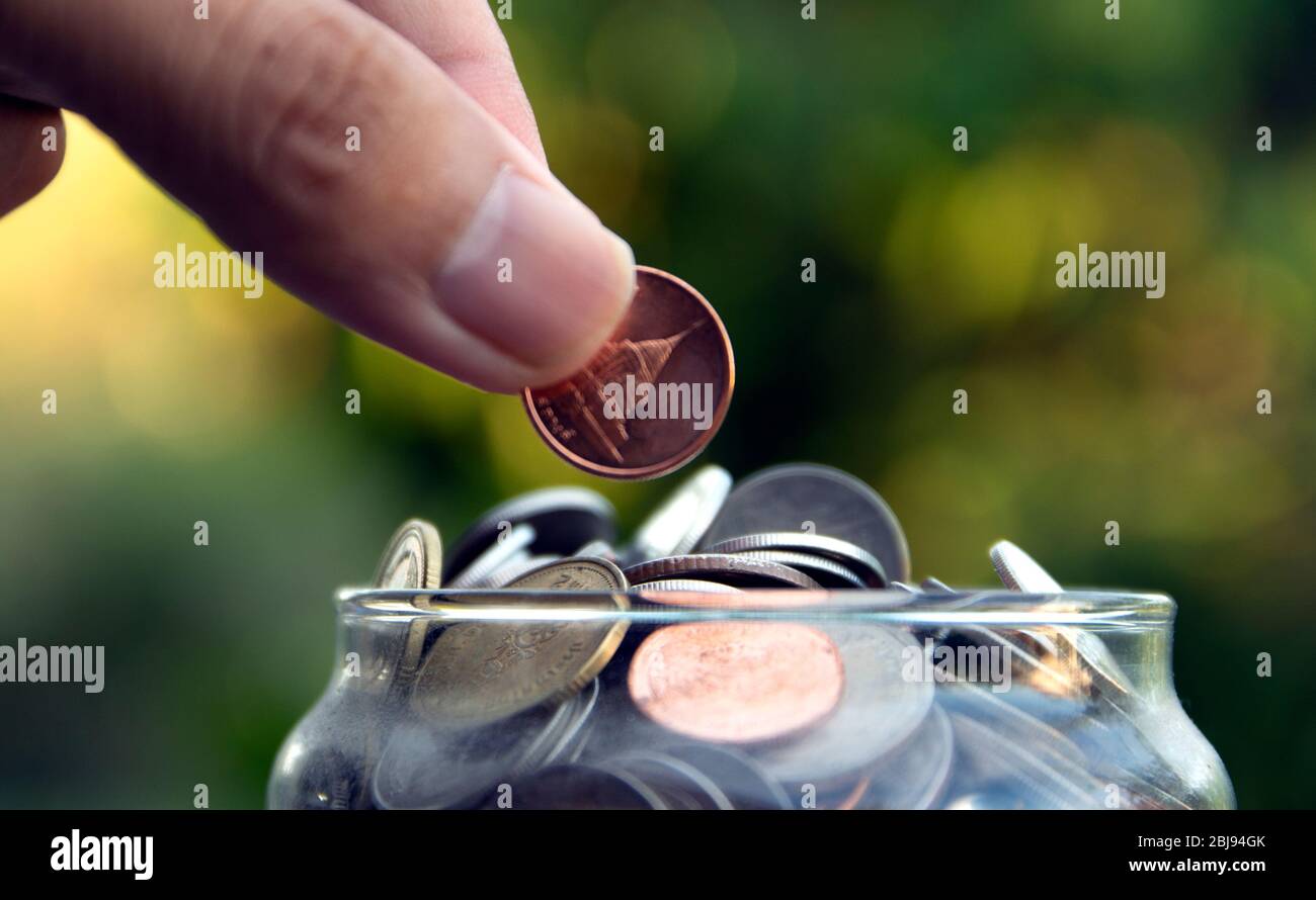 Save money coins , Saving for buy home concept Stock Photo - Alamy