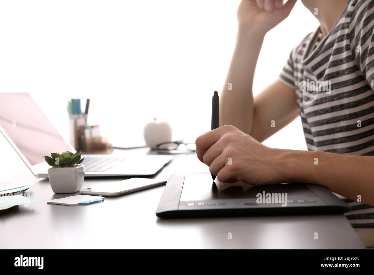 Man using graphic tablet at office Stock Photo - Alamy