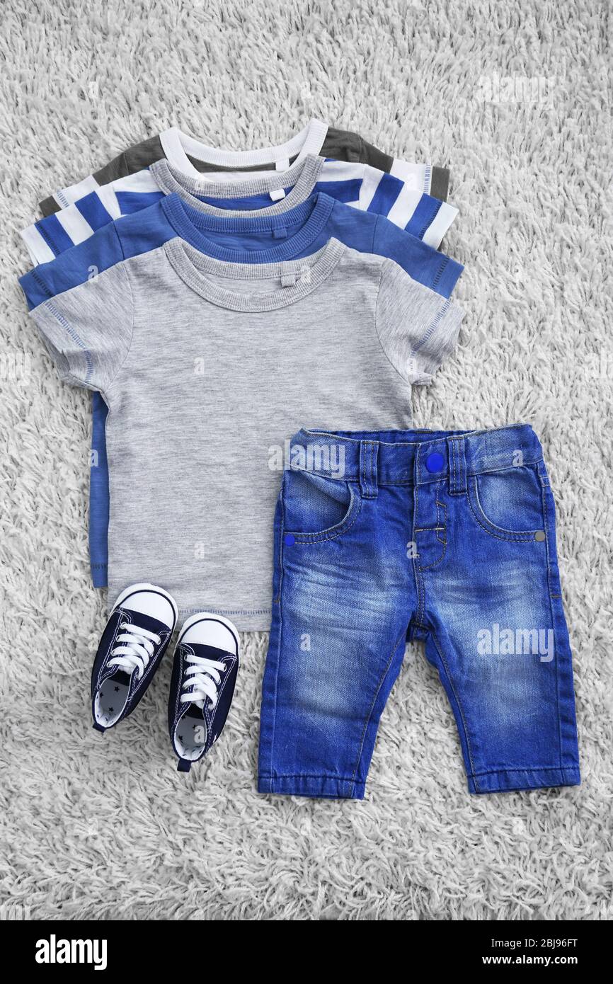 Child clothes on light background Stock Photo - Alamy