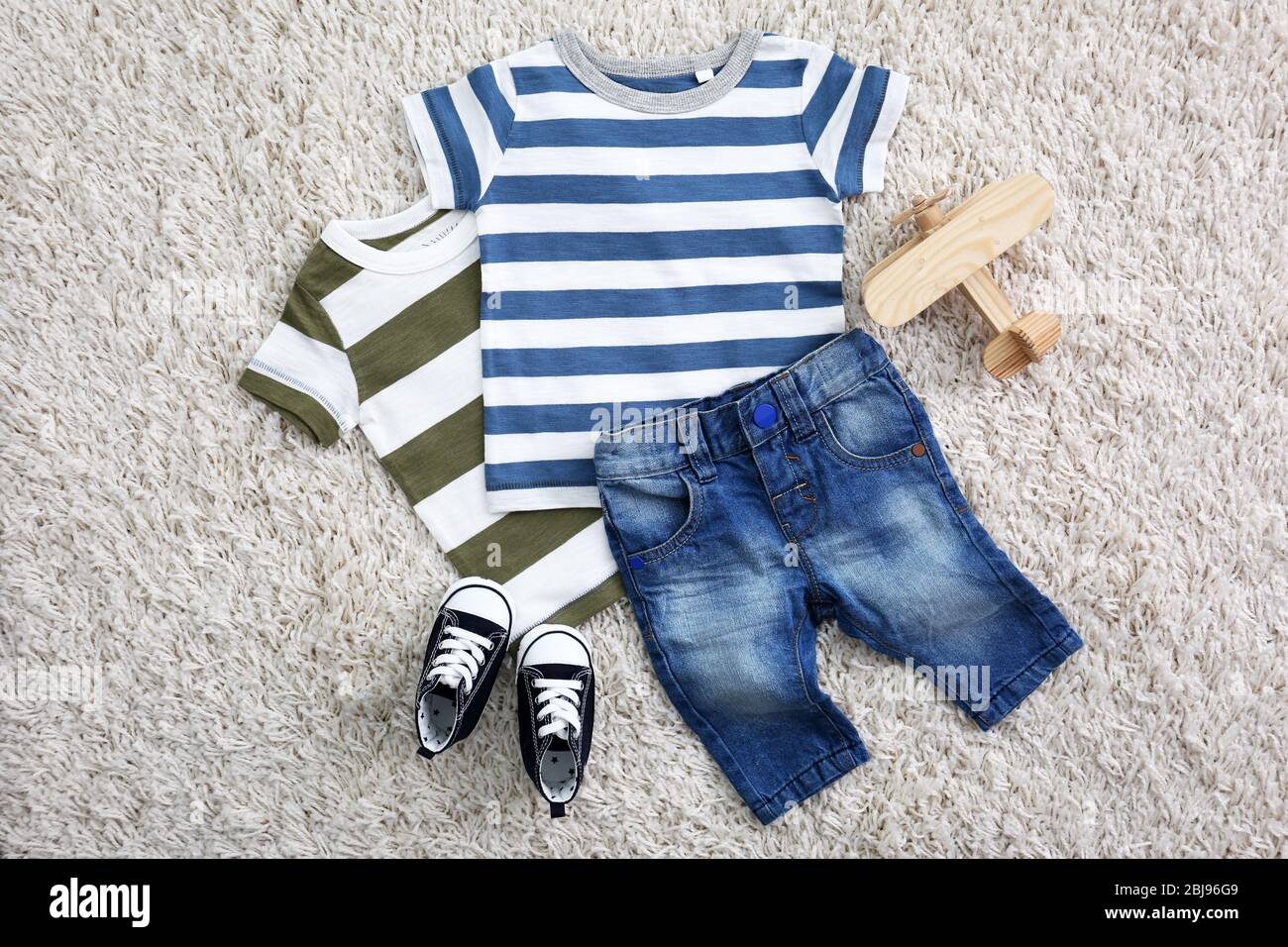 Child clothes on light background Stock Photo - Alamy