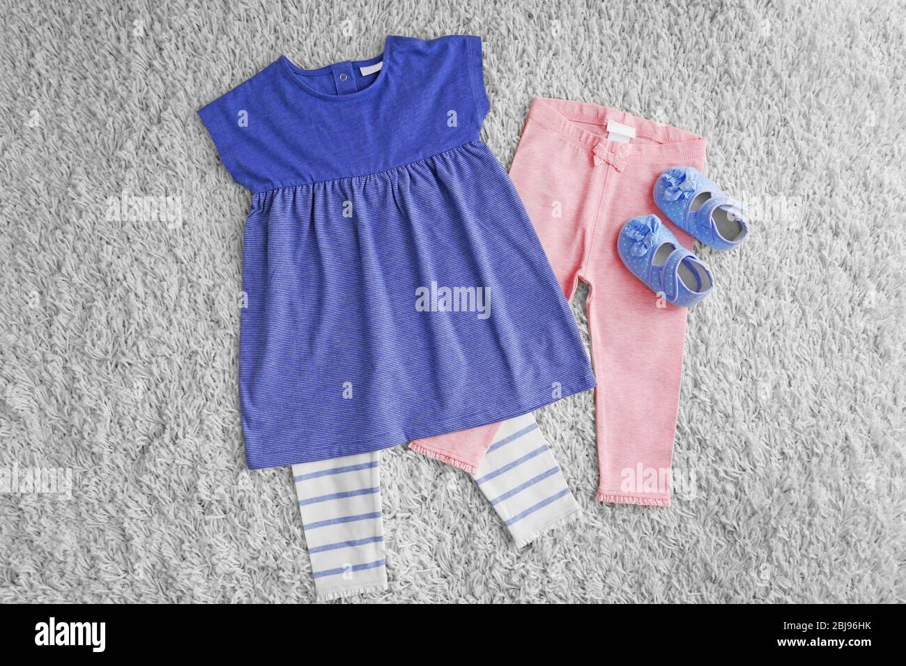 Child clothes on light background Stock Photo - Alamy