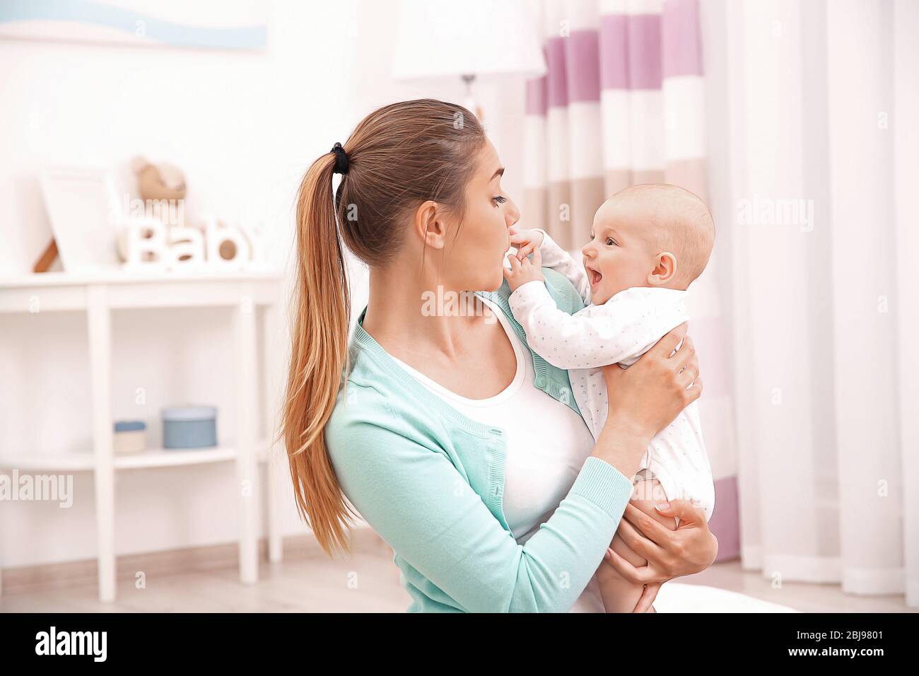 Mother and her little baby at home Stock Photo - Alamy
