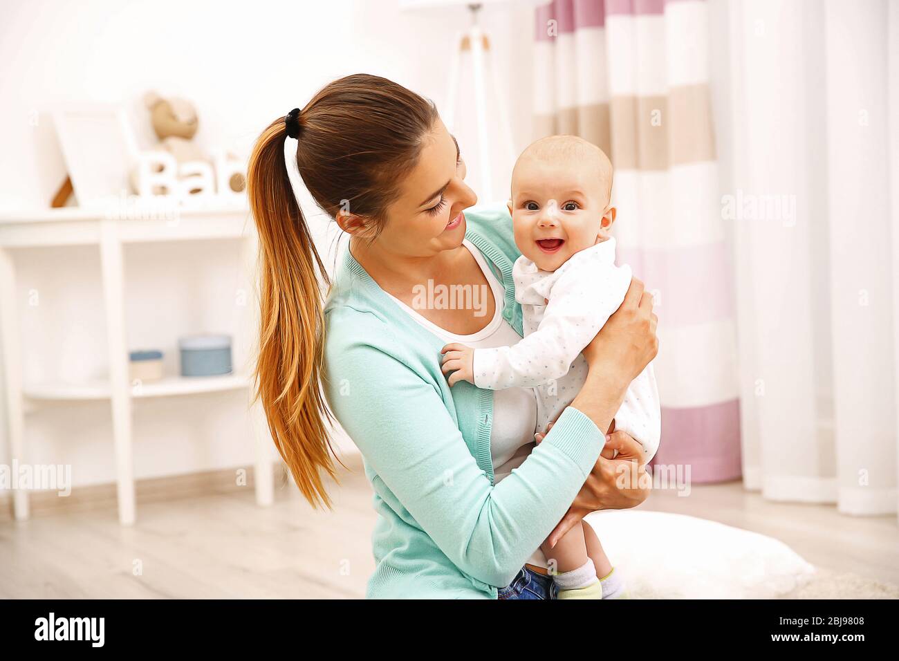 Mother and her little baby at home Stock Photo - Alamy