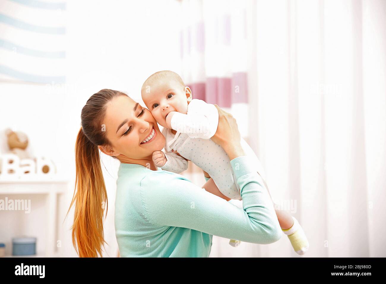 Mother and her little baby at home Stock Photo - Alamy