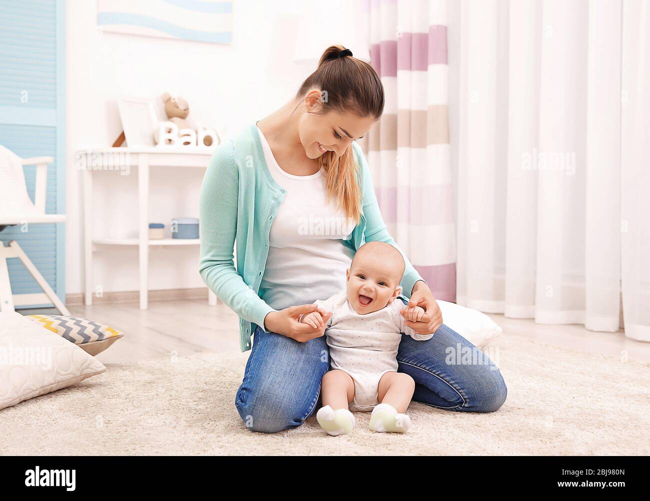 Mother and her little baby at home Stock Photo - Alamy